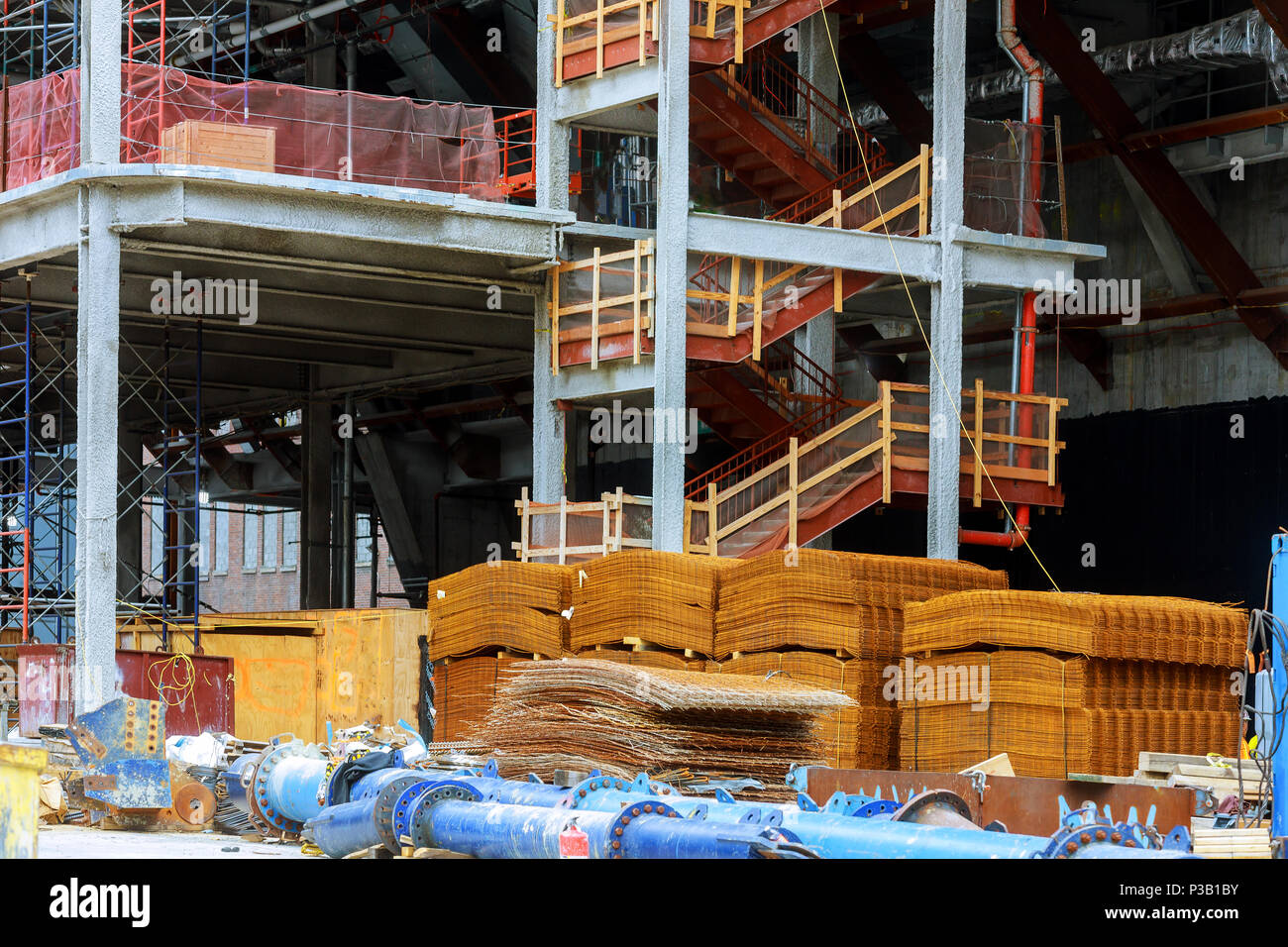 Detail of high rise building in construction site workers unfinished ...