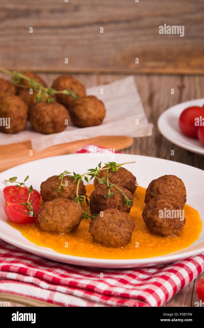 Meatballs with carrot purée Stock Photo - Alamy