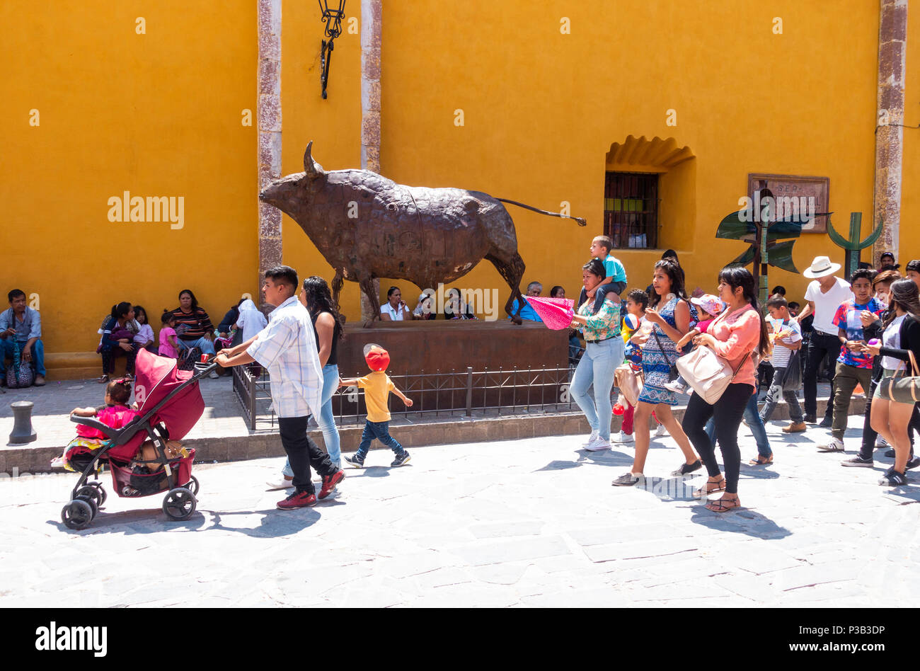 Mexican family on for a Sunday walk in San Miguel de Allende, passing ...