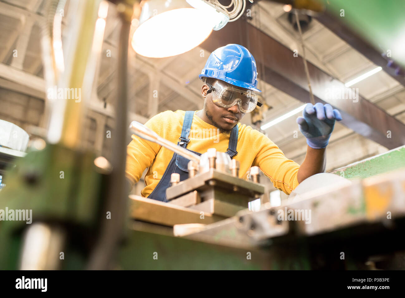 Factory machine repair person hi-res stock photography and images - Alamy