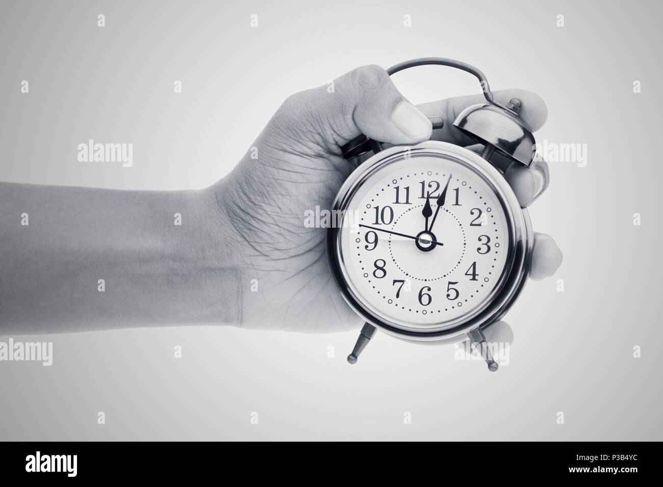 Man hands holding big round clock, isolated on white Stock Photo - Alamy