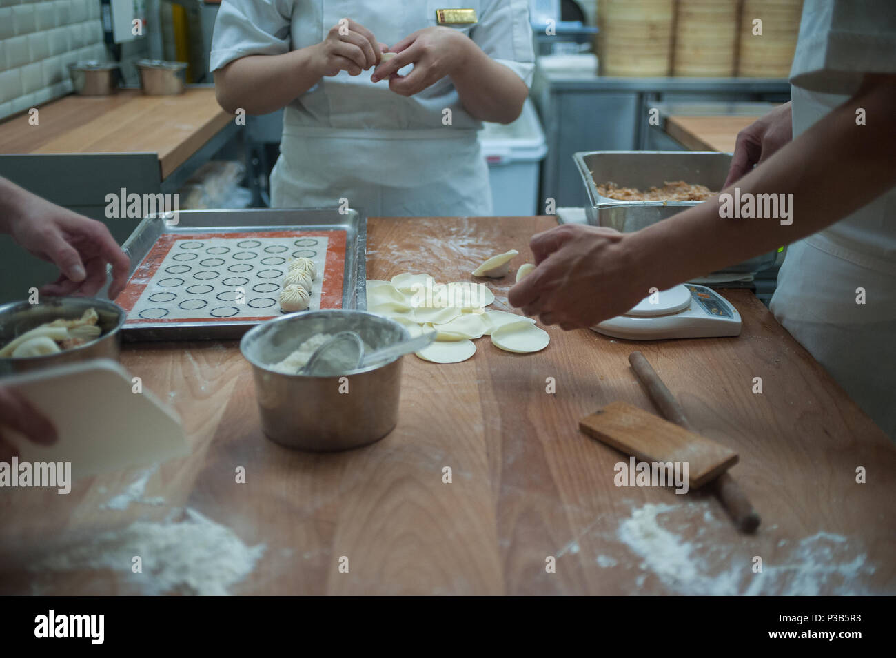 Singapore, Republic of Singapore, Koeche prepare dumplings Stock Photo ...