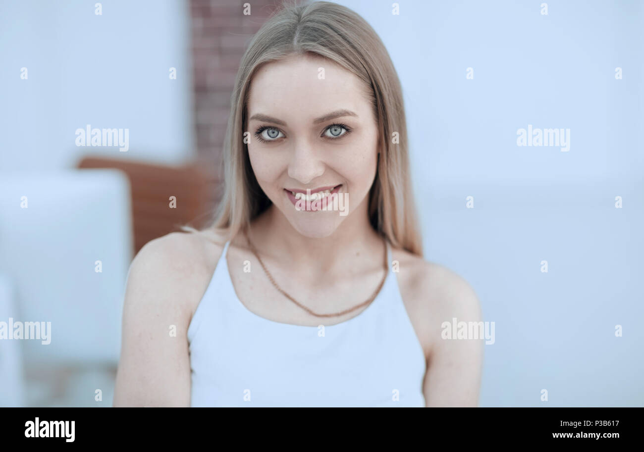 close-up portrait of a young woman on a blurred office background Stock ...