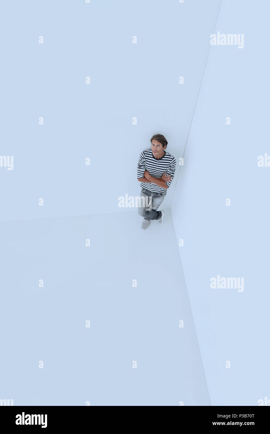 handsome guy standing near the white wall Stock Photo - Alamy
