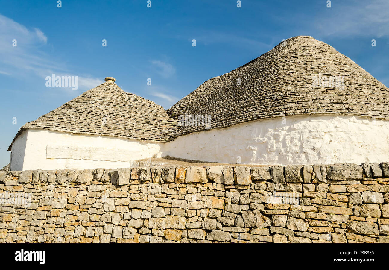 Typical trulli buildings with conical roofs in Alberobello, Apulia ...