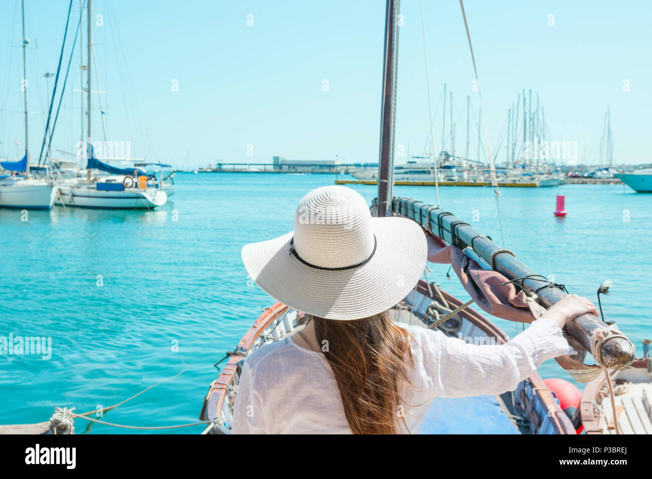 Attractive Young Caucasian Woman with Long Hair in Hat Stands in ...