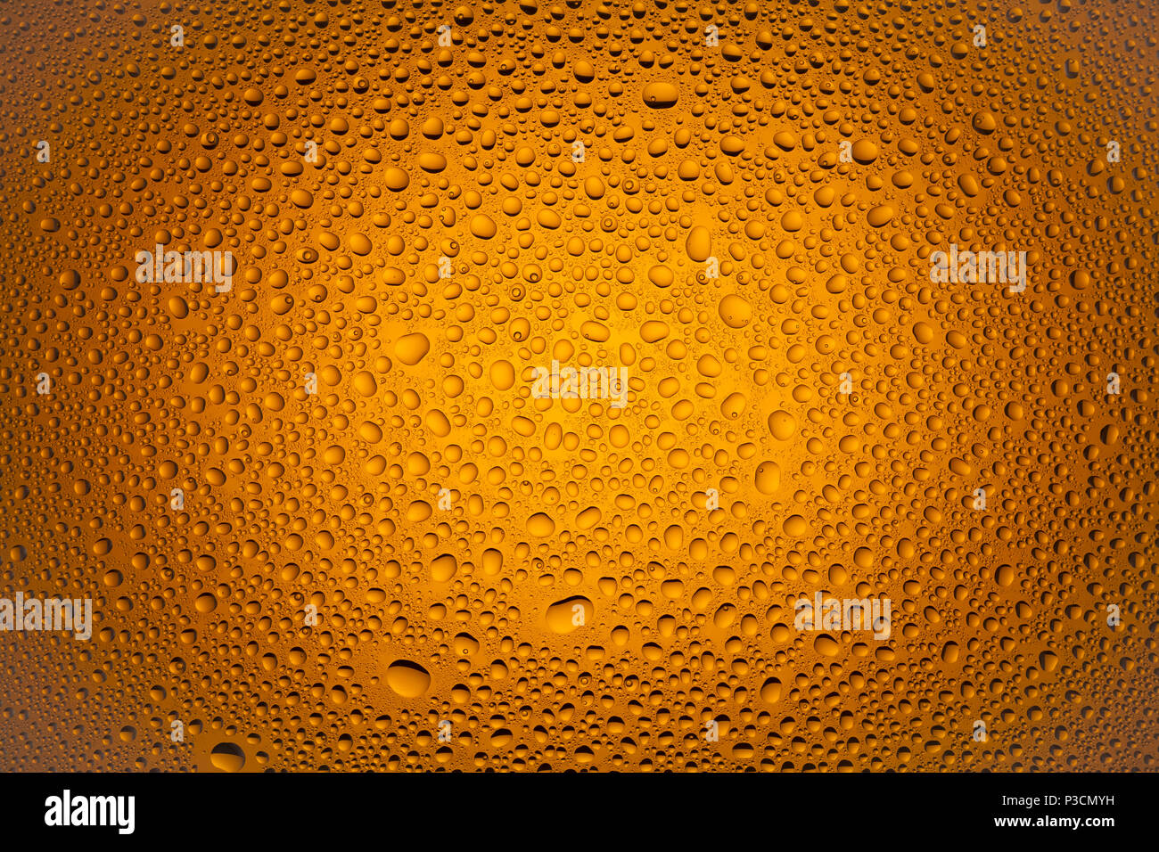 Close up of a water drops on a orange gradient background, covered with ...