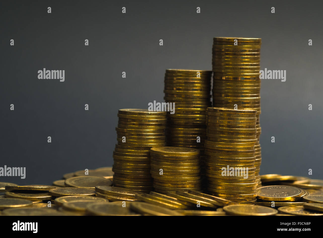 Savings, increasing columns of coins, piles of coins arranged as a ...