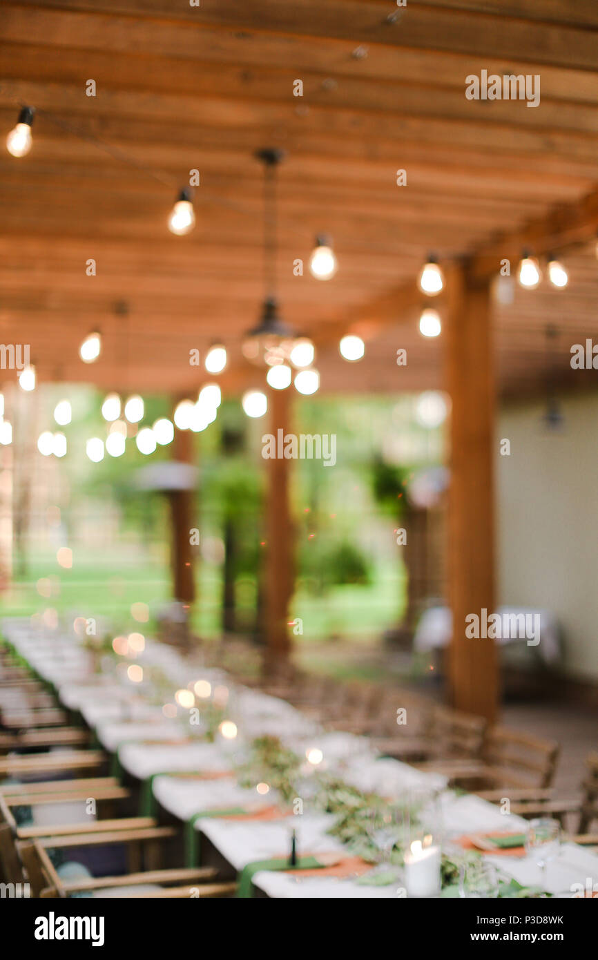 Blurred decorated table for wedding party at restaurant Stock Photo - Alamy