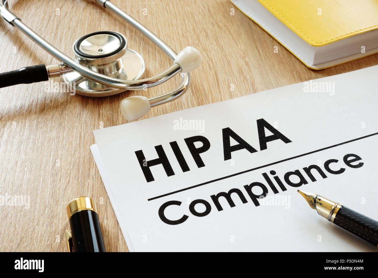 HIPAA Compliance application and stethoscope on a desk Stock Photo - Alamy