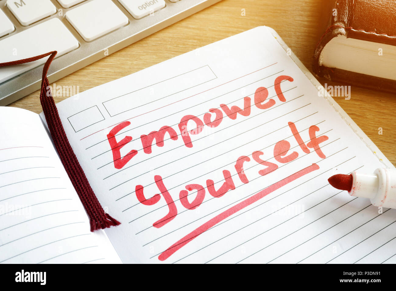 Empower yourself handwritten in a notepad Stock Photo - Alamy