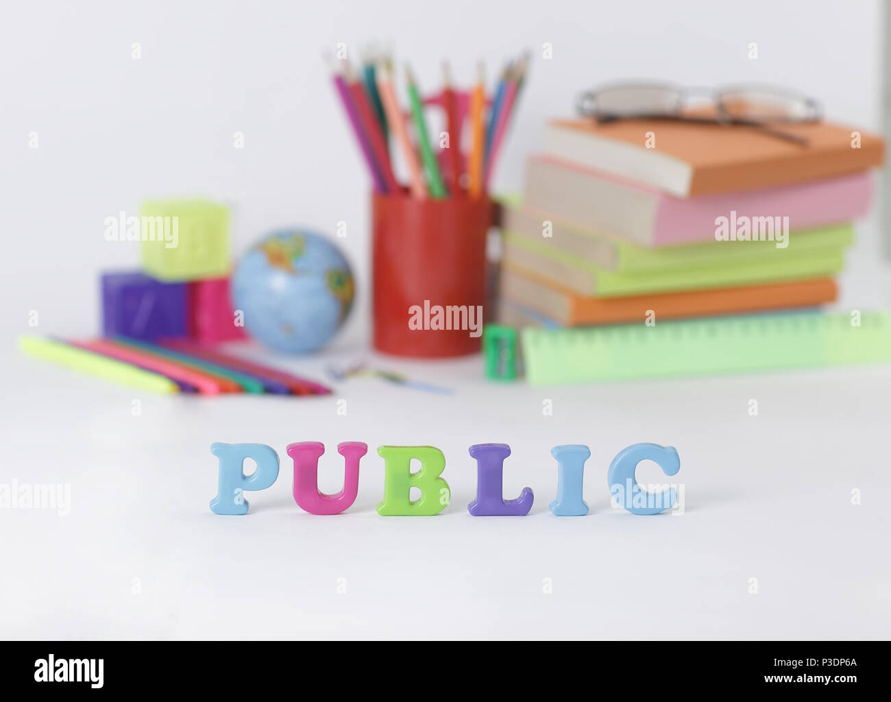 word public on blurred background of school supplies .photo with copy ...