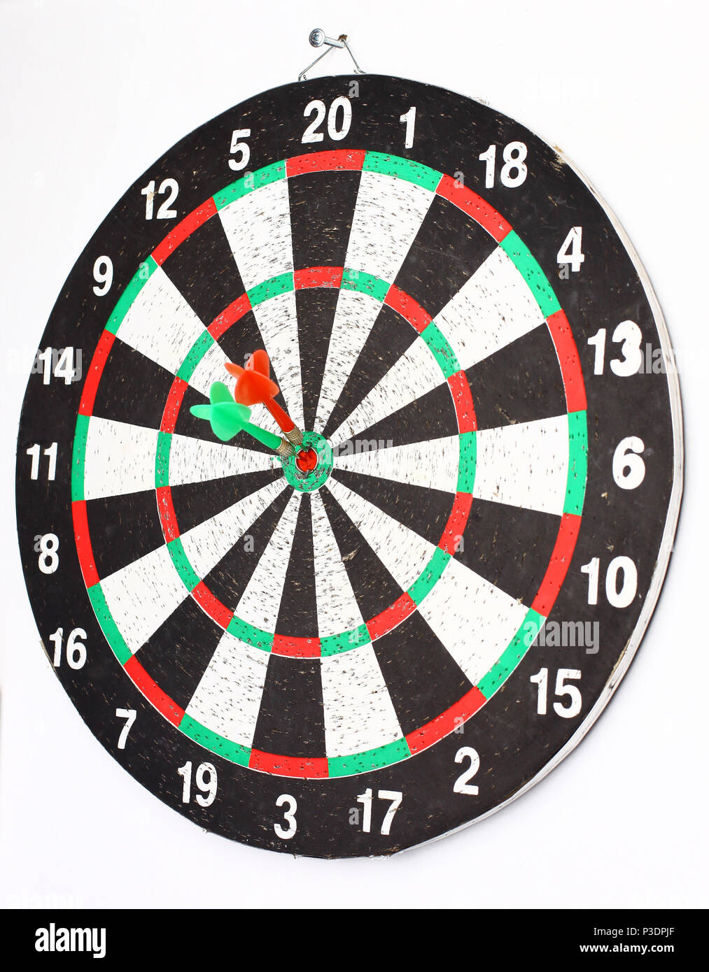 side view.Arrow dart hitting the center of the target dart Board Stock ...