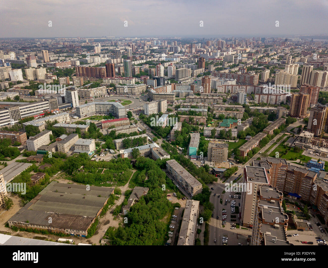 Old and new russian buildings in green area in the city with a lot of ...