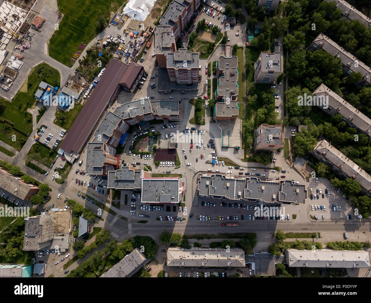 Aerial view of old and new russian buildings in green area in the city ...