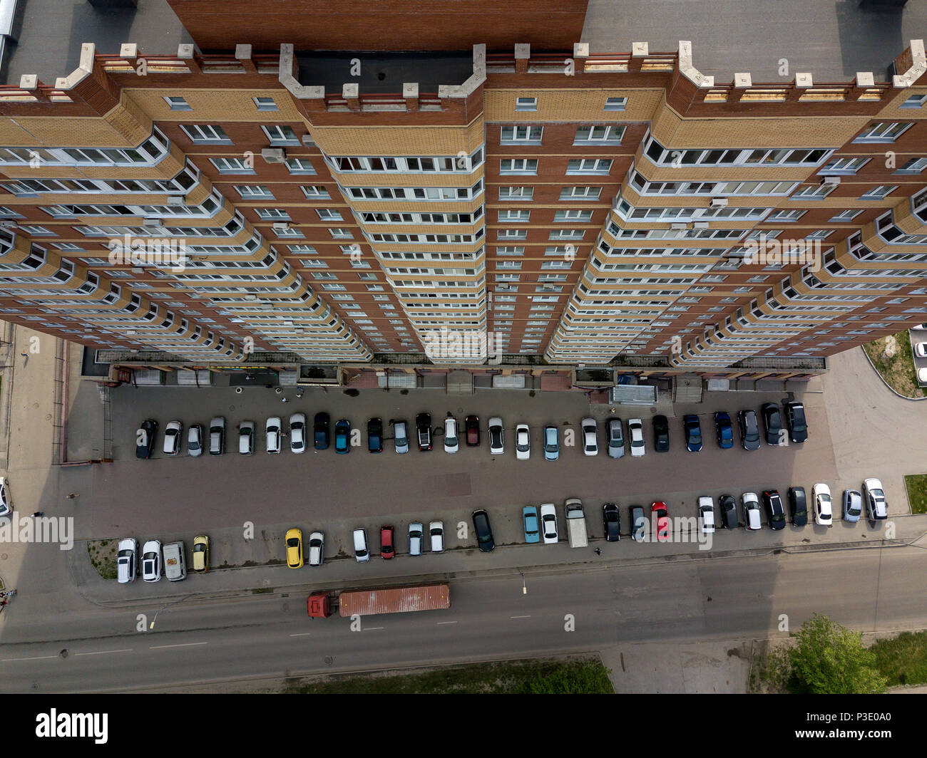 Aerial view of new russian one building with parking and cars traffic ...