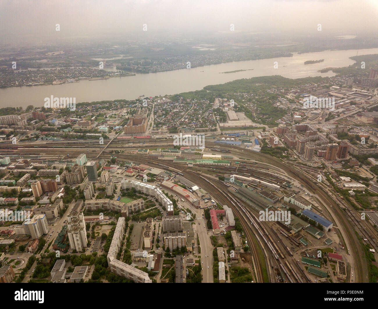 Aerial view of old and new russian buildings with rails and river in ...