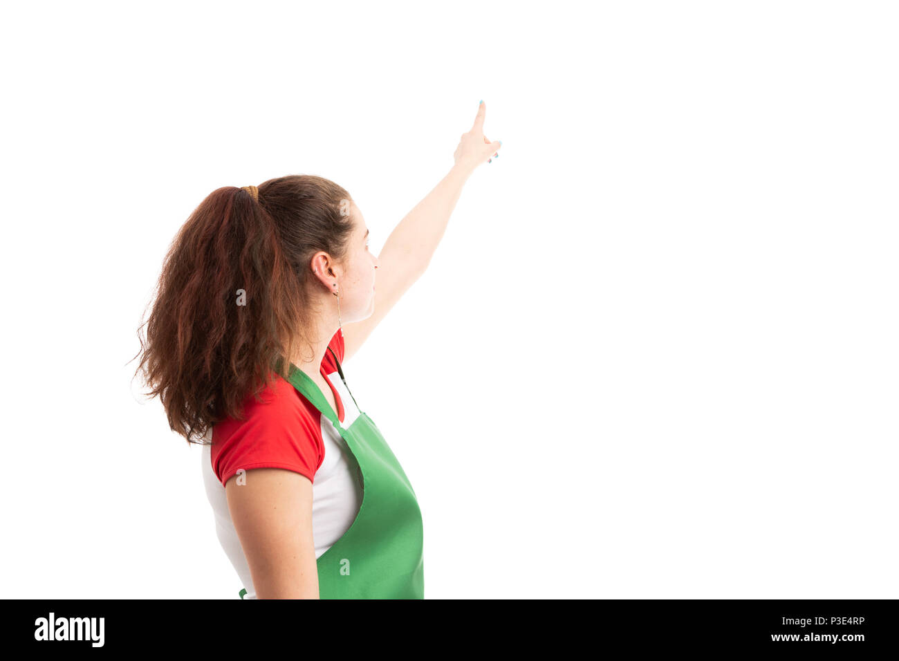 Young female supermarket or retail employee pointing up with index ...