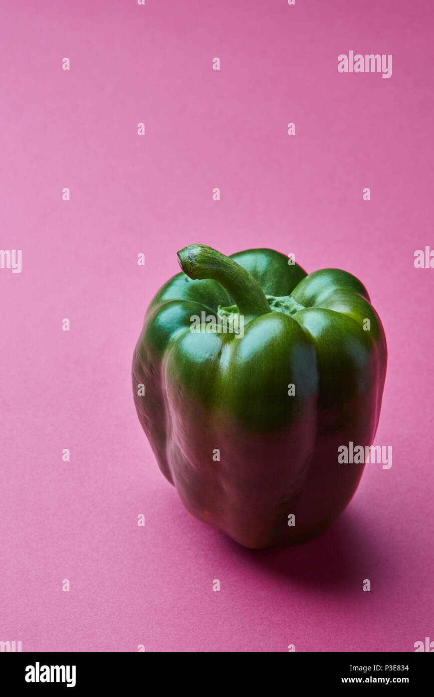 Fresh green paprika isolated on pink background Stock Photo - Alamy