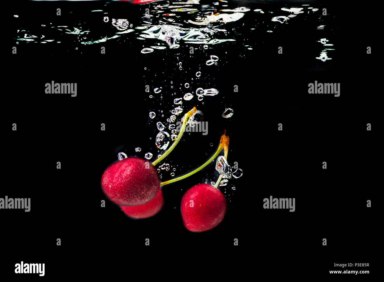 Cherry water splash hi-res stock photography and images - Alamy