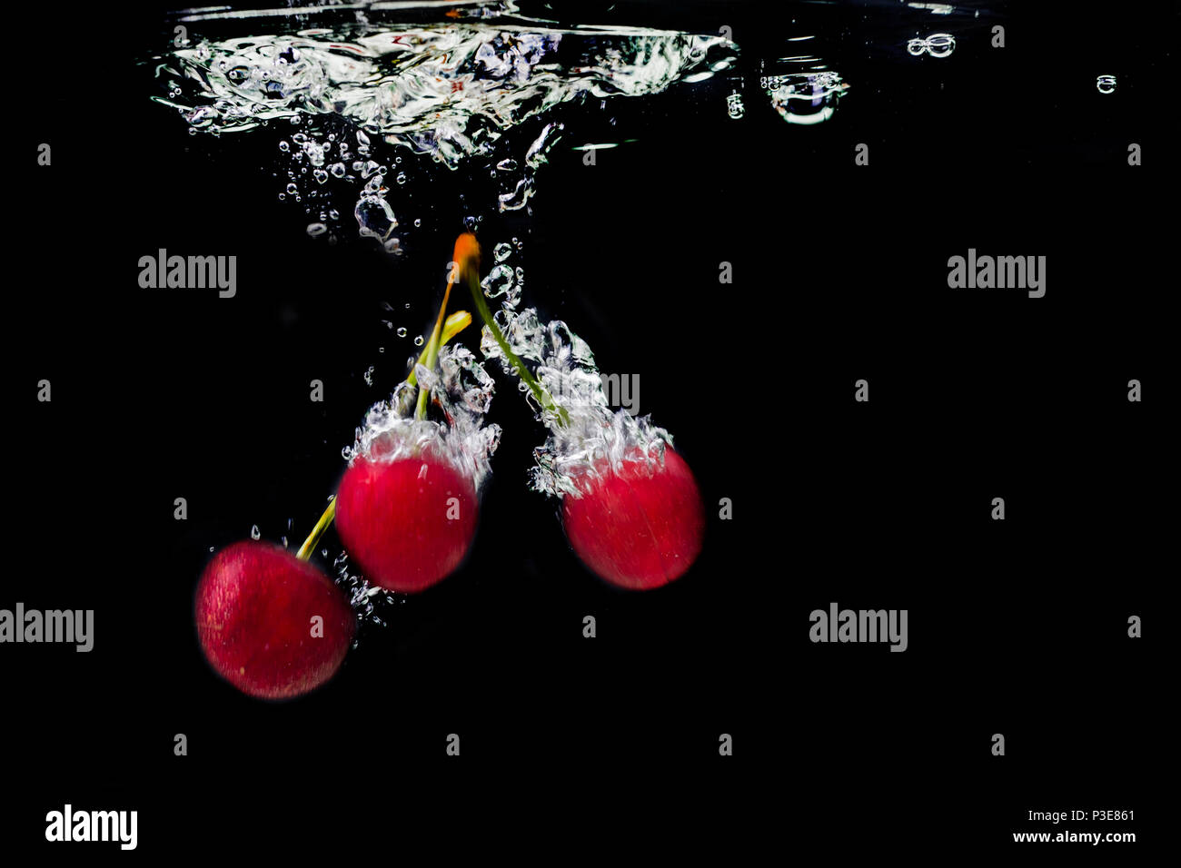 Cherry fruit red water splash white hi-res stock photography and images ...