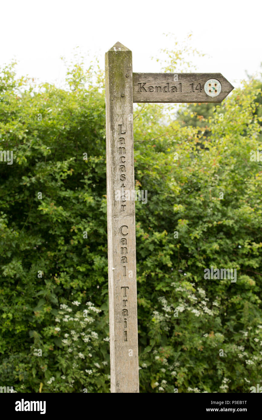Wooden signpost near Tewitfield Locks on the Cumbria/Lancashire border ...