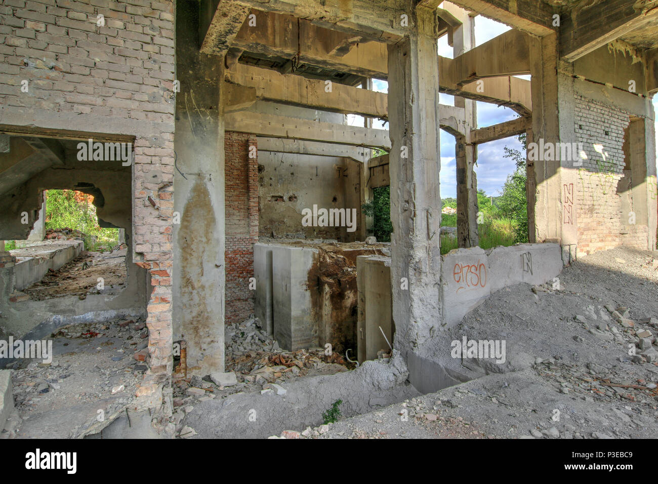Abandoned and dilapidated factory overgrown of vegetation Stock Photo ...