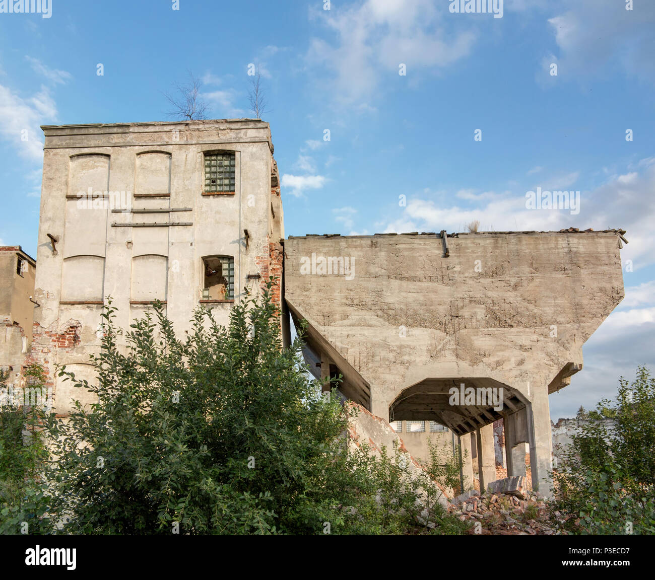 Abandoned and dilapidated factory overgrown of vegetation Stock Photo ...