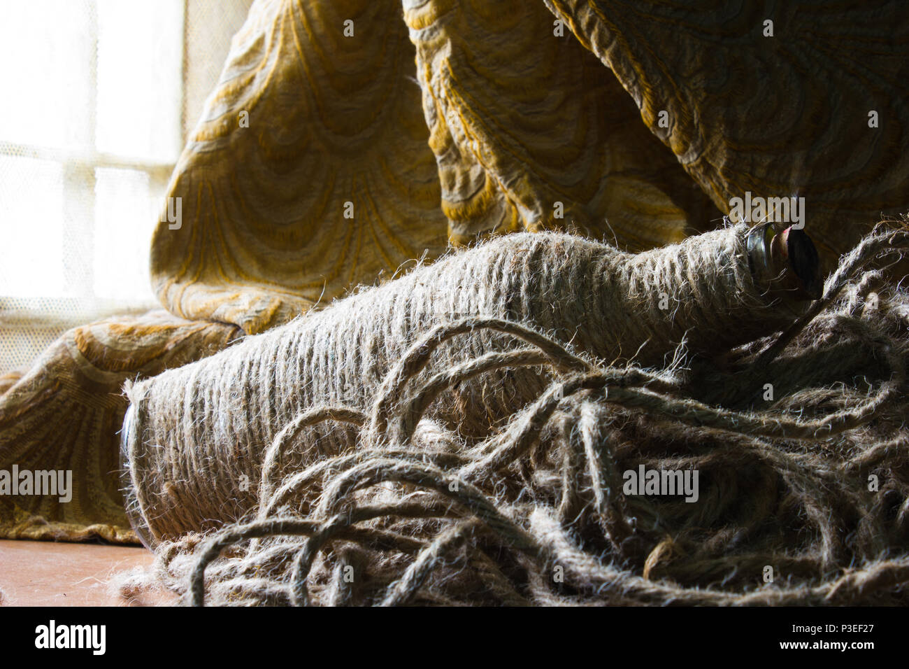 Bottle Wound up by Rope in a Brown Background Stock Photo - Alamy