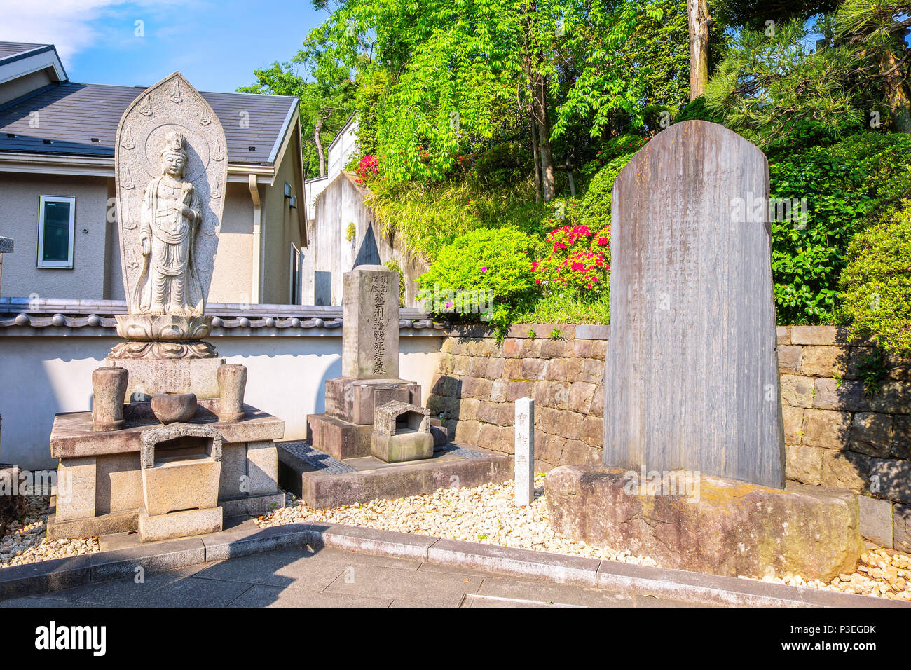 TOKYO, JAPAN - APRIL 20 2018: Tombs and religious statue at Sengakuji ...