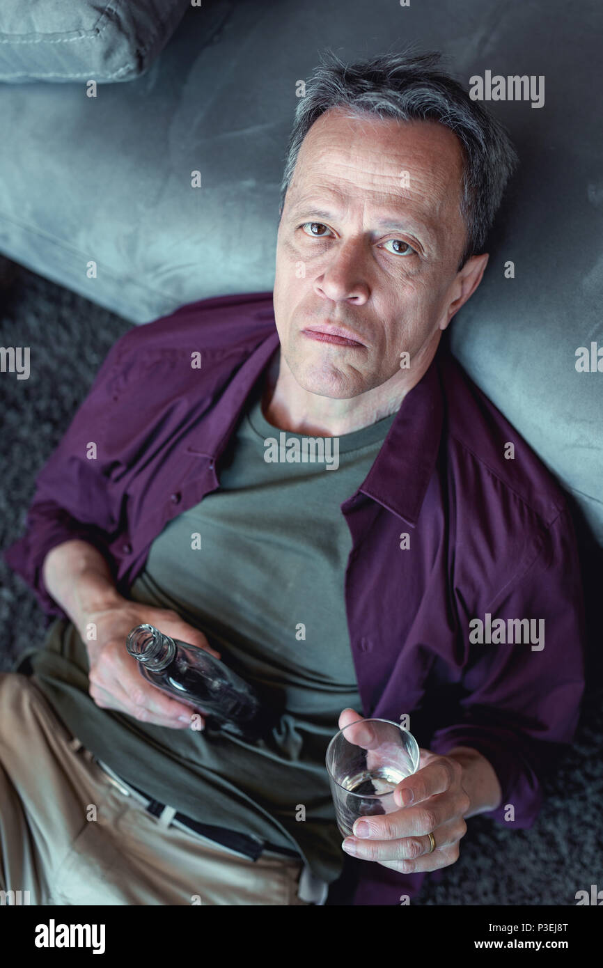 Grey-haired man feeling fed up while suffering from humiliating Stock ...