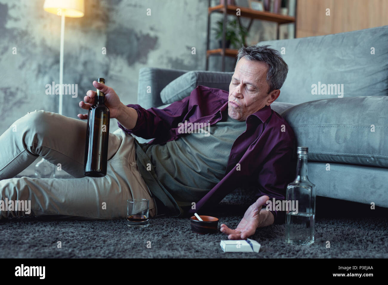 Grey-haired addicted man looking awful Stock Photo - Alamy