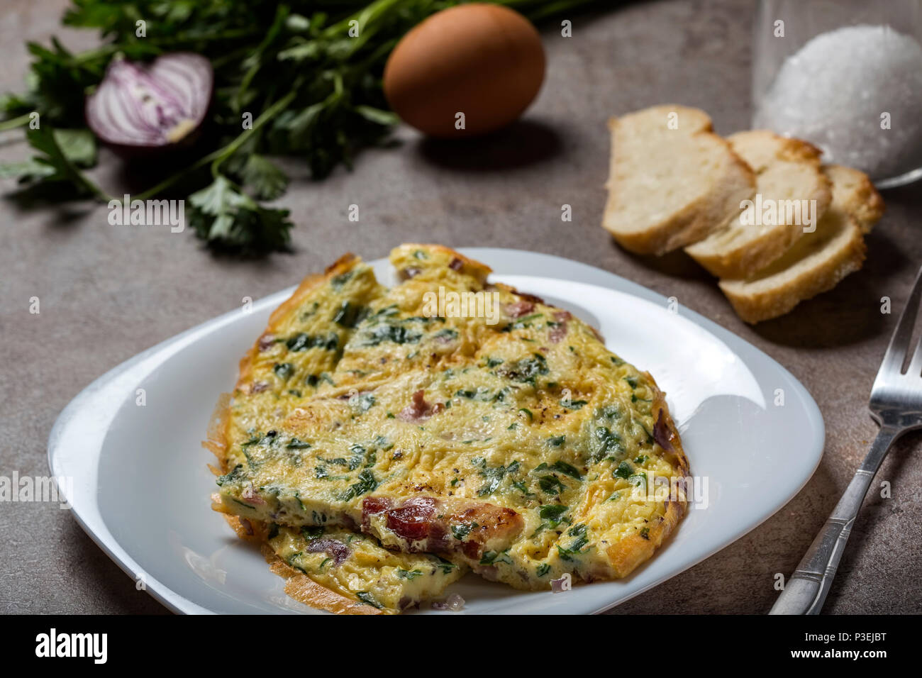 Omelet made from eggs, bacon, cheese and onion on plate Stock Photo - Alamy