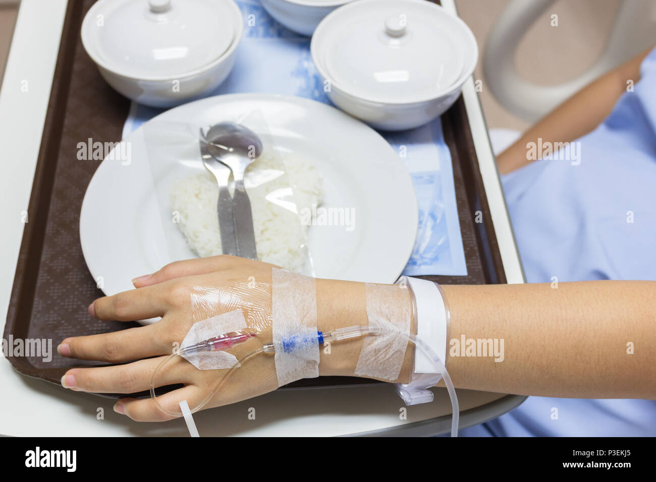 Asian Pregnant Woman patient is on drip receiving a saline solution ...