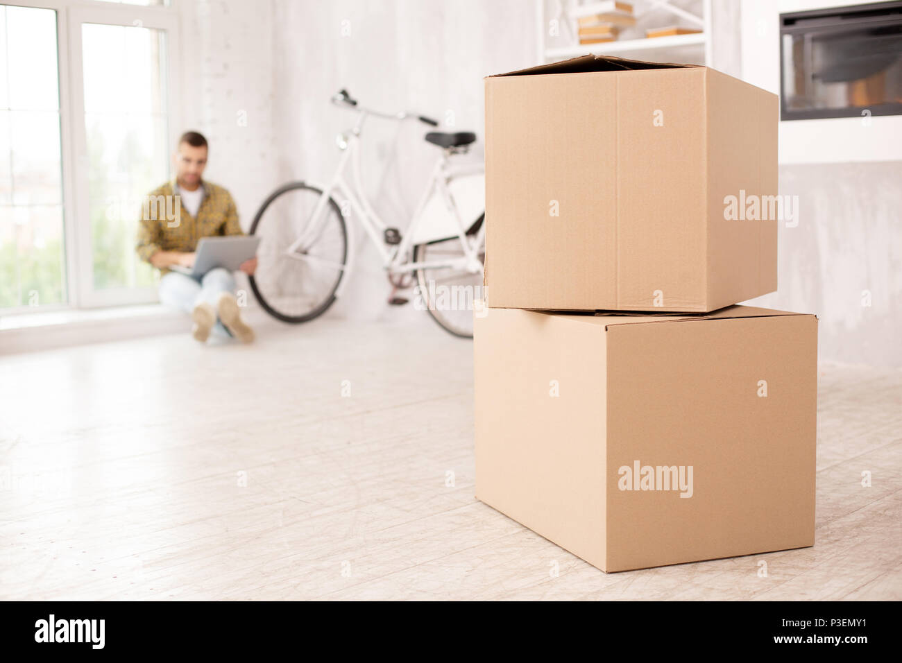Bearded young man desiring to move out Stock Photo - Alamy