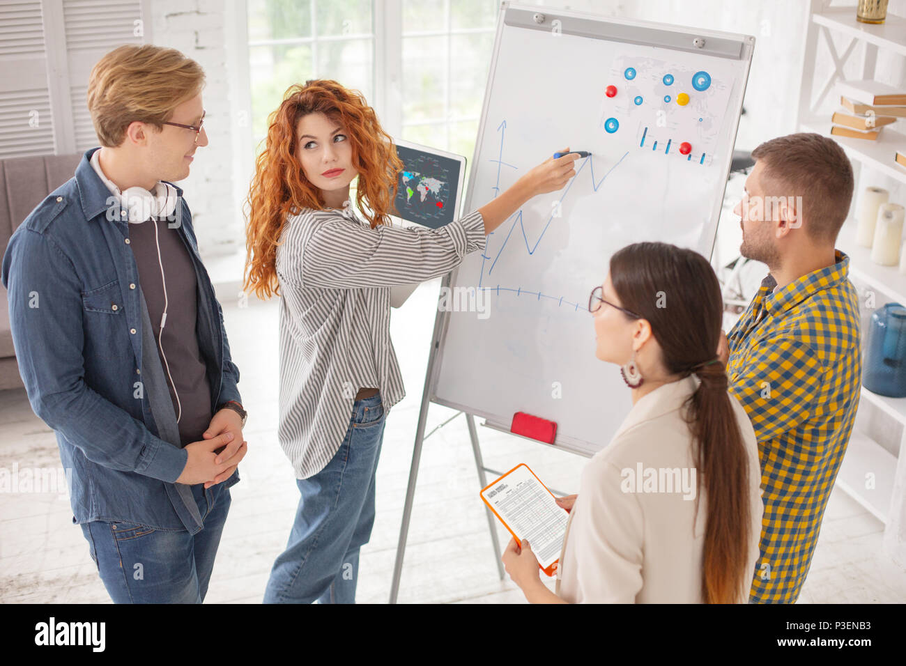 Clever four colleagues planning development Stock Photo - Alamy