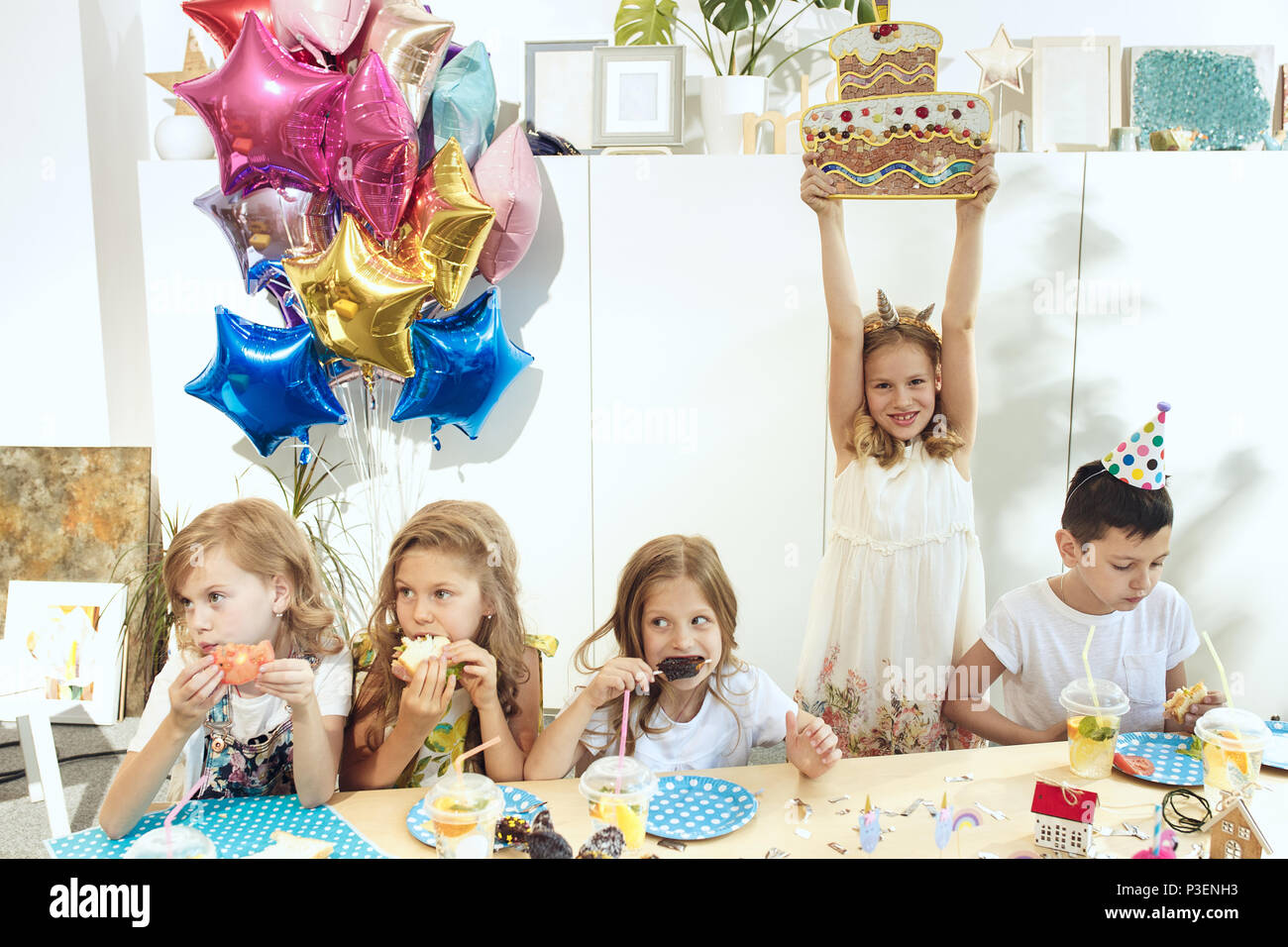 Girl birthday decorations. table setting with cakes, drinks and party ...