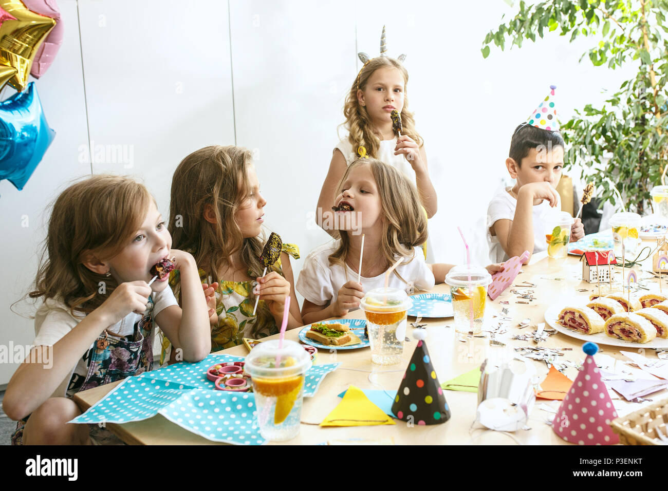 Girl birthday decorations. table setting with cakes, drinks and party ...