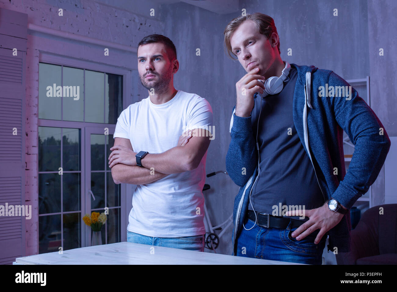 Thoughtful male colleagues organizing work Stock Photo - Alamy