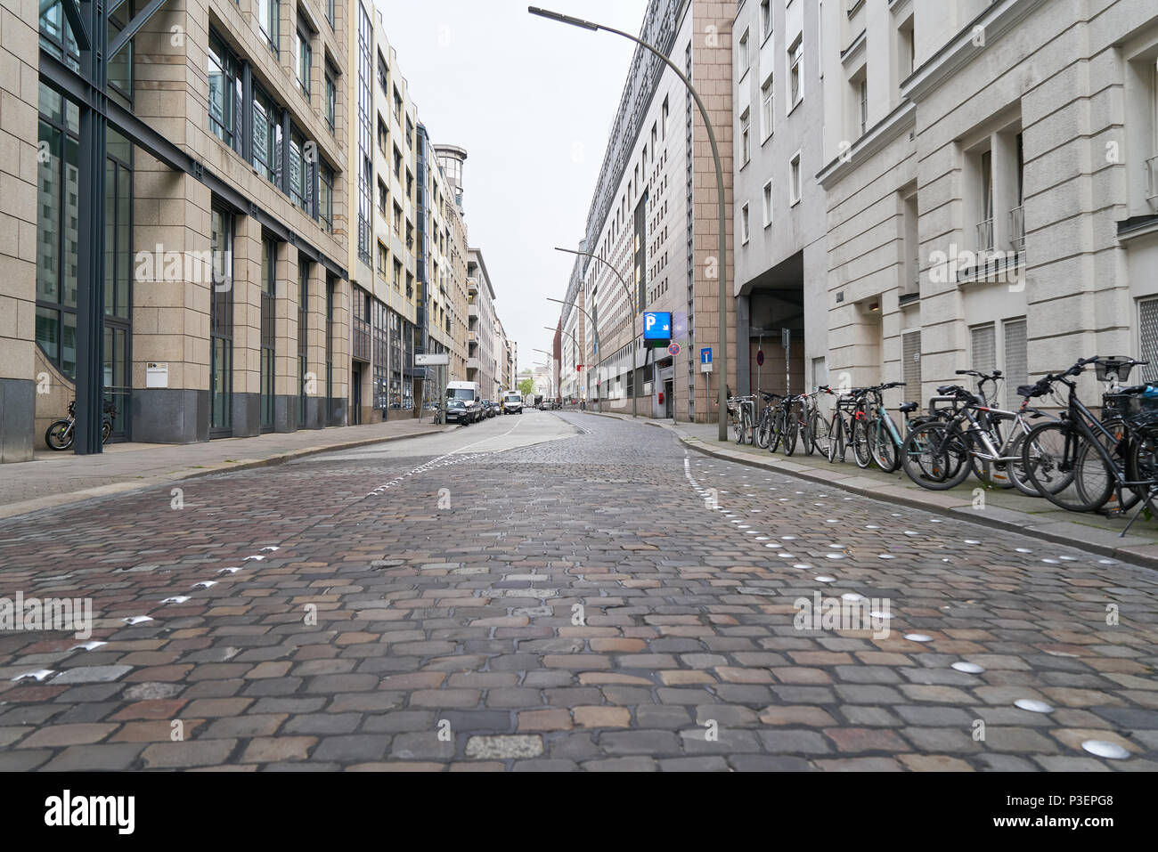 Empty road consisting of paving stones in a German city Stock Photo - Alamy
