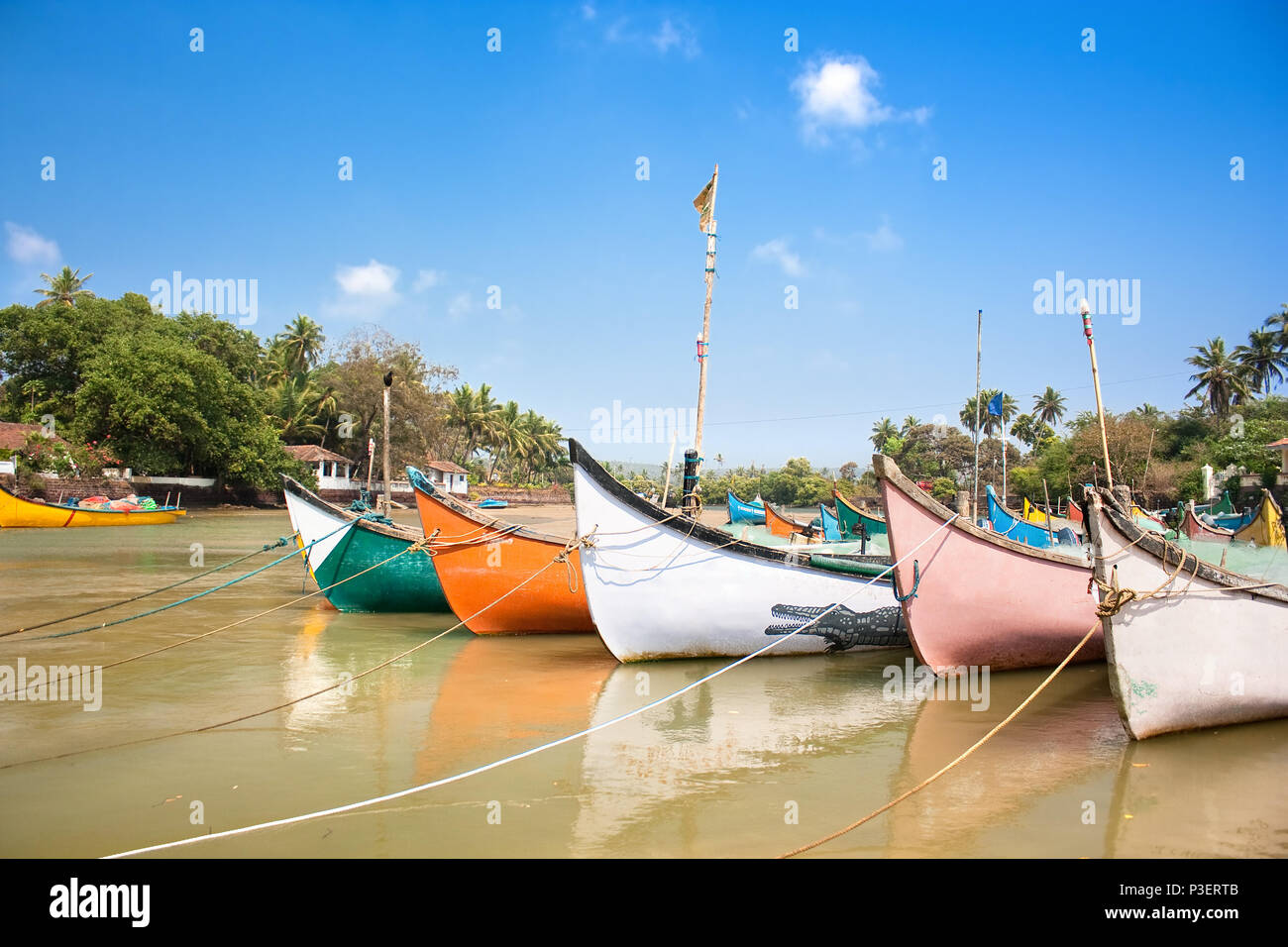 Wooden outrigger fishing boats on delta of Baga river at Calangute ...