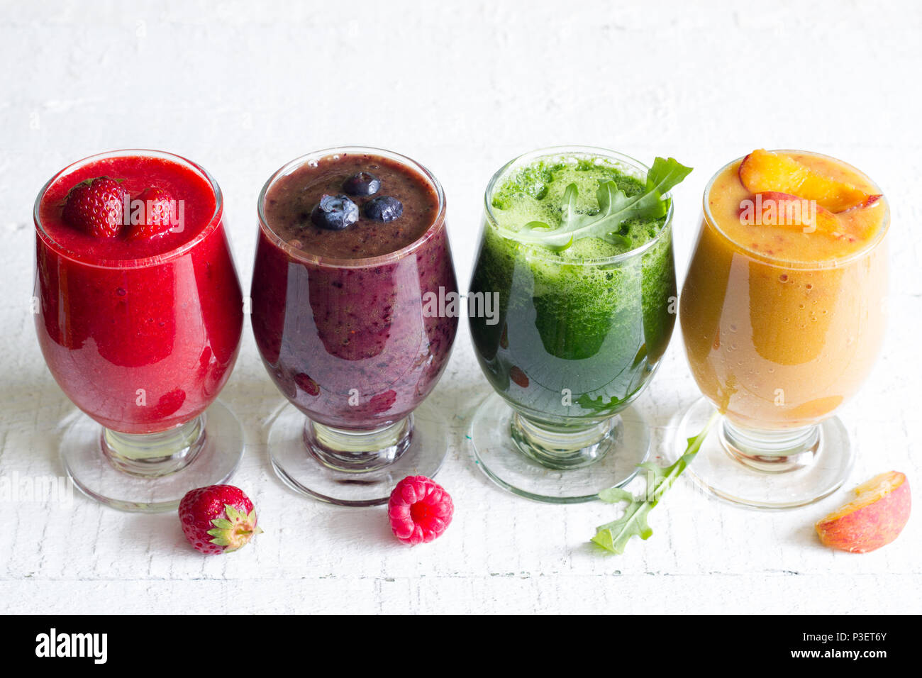 Smoothie juice with healthy fresh raw fruits and vegetables on white ...