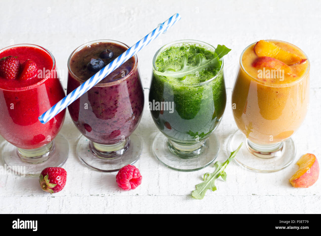 Smoothie juice with healthy fresh raw fruits and vegetables on white ...