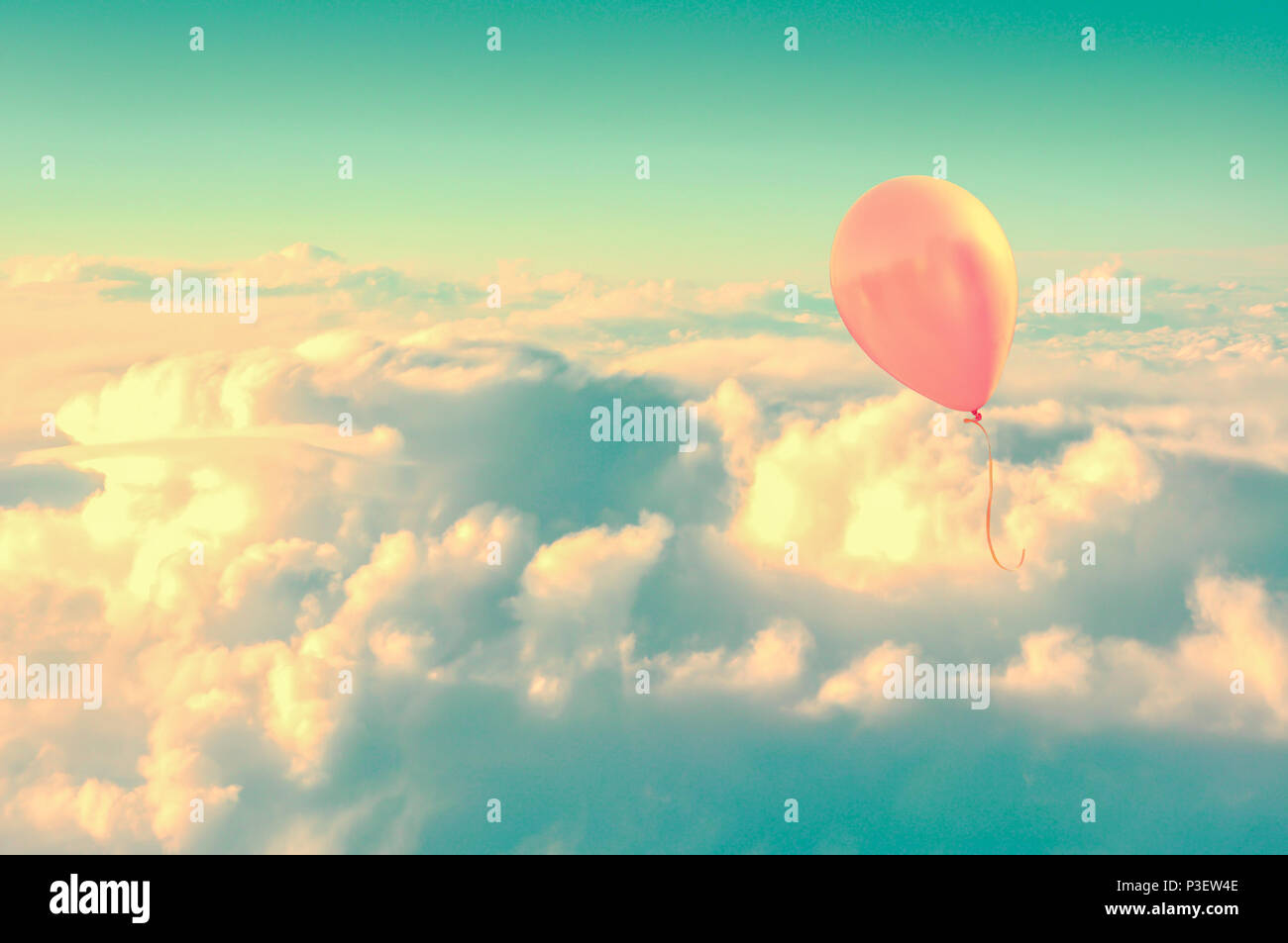 Pink air balloon flying high in the sky above the clouds, vintage ...