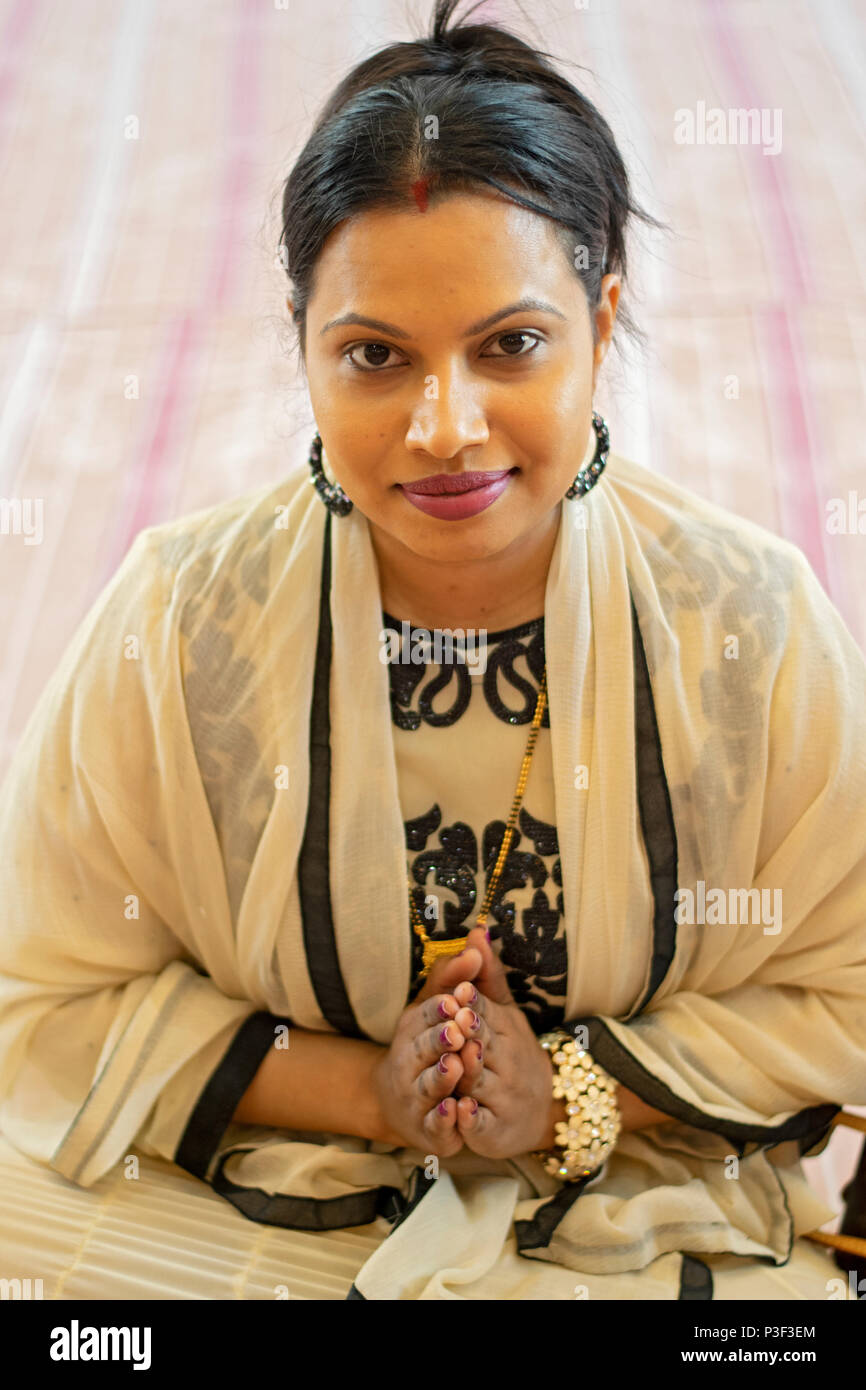Posed portrait of a beautiful Hindu worshipper at the Tulsi Mandir ...