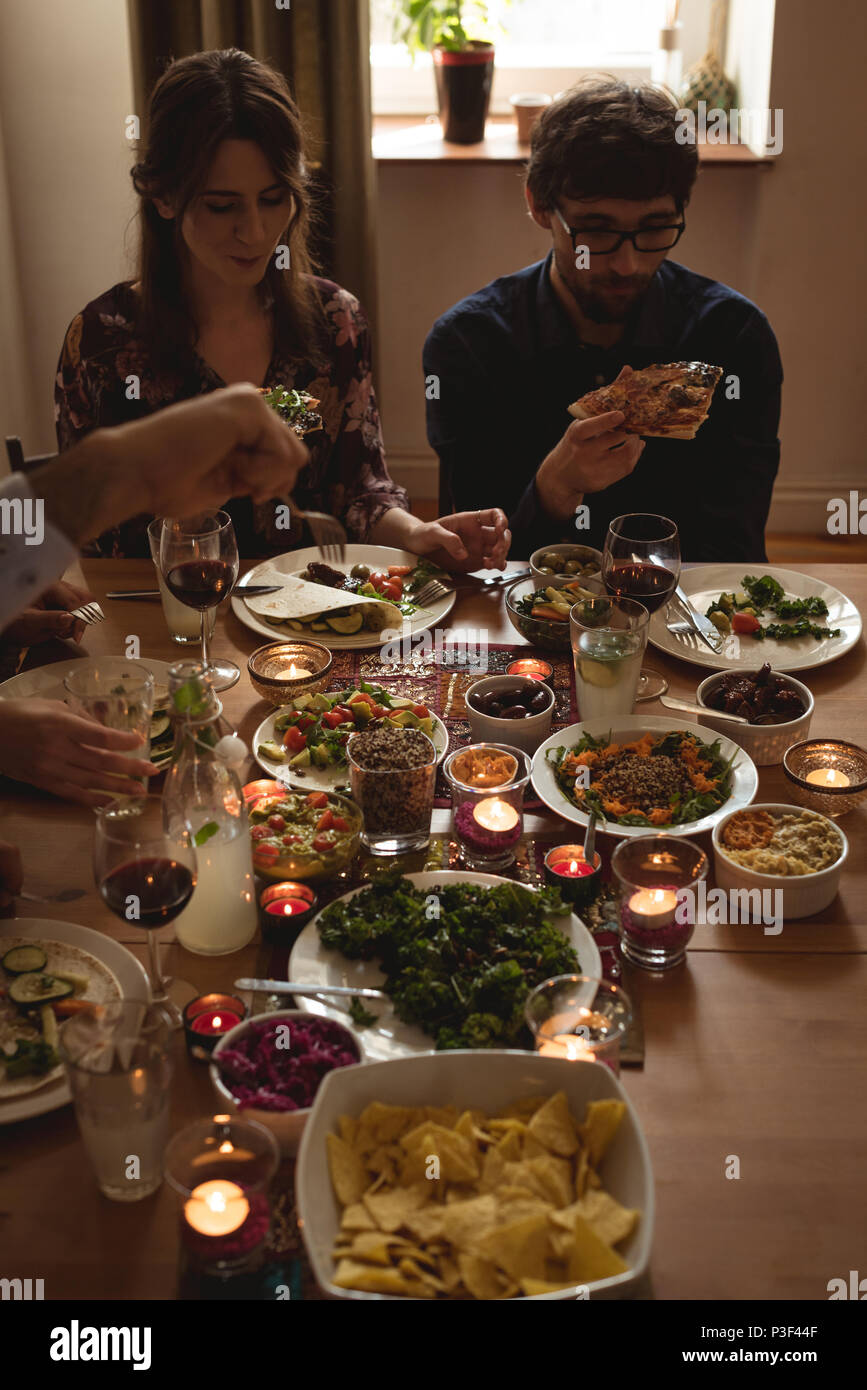 Friends having meal table hi-res stock photography and images - Alamy