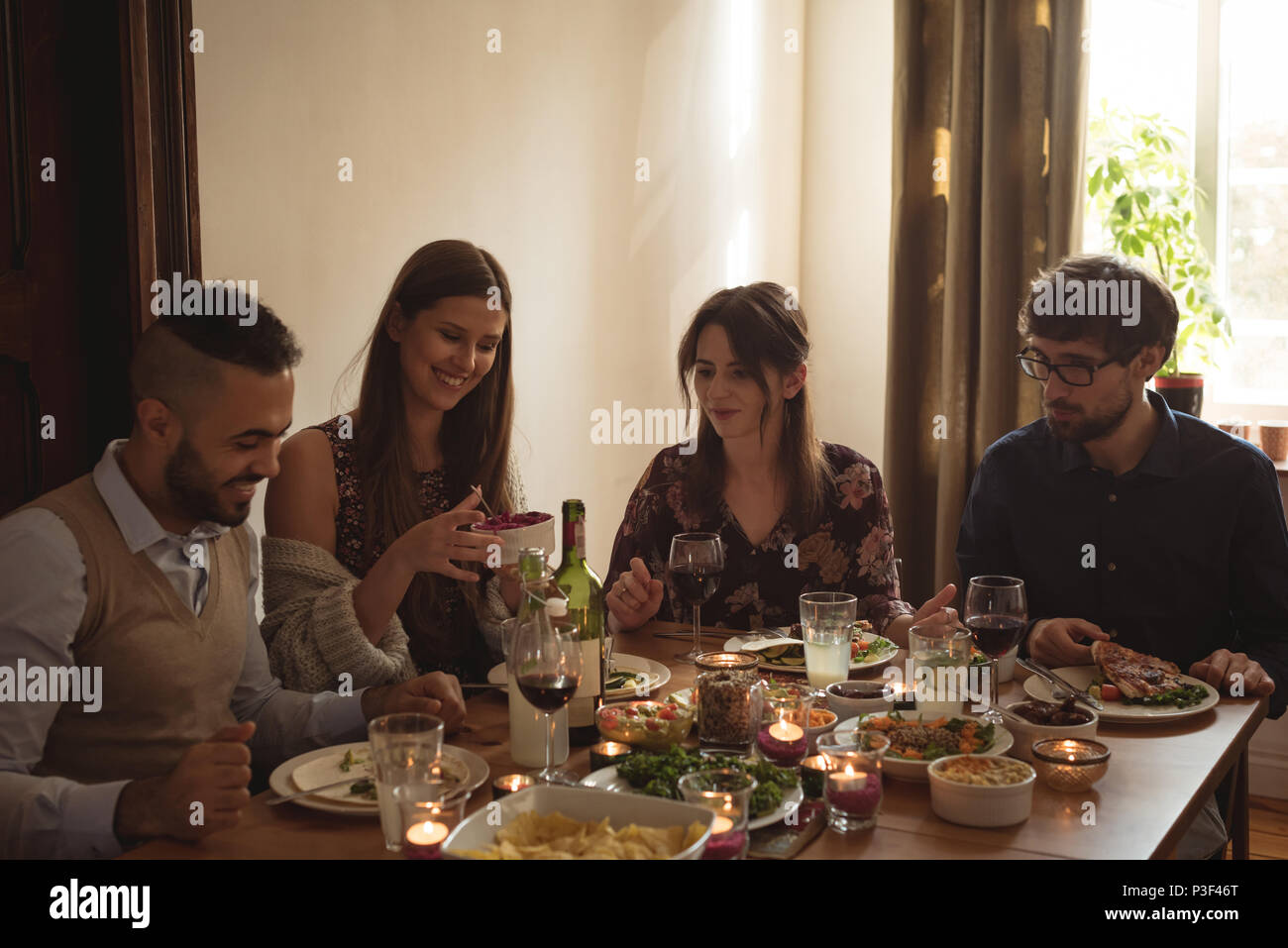 Friends having meal table hi-res stock photography and images - Alamy