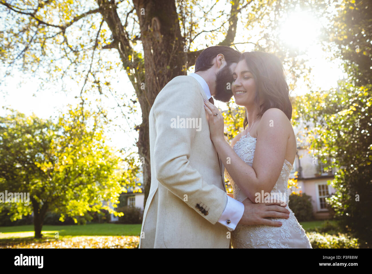 Bride hugging tree hi-res stock photography and images - Alamy