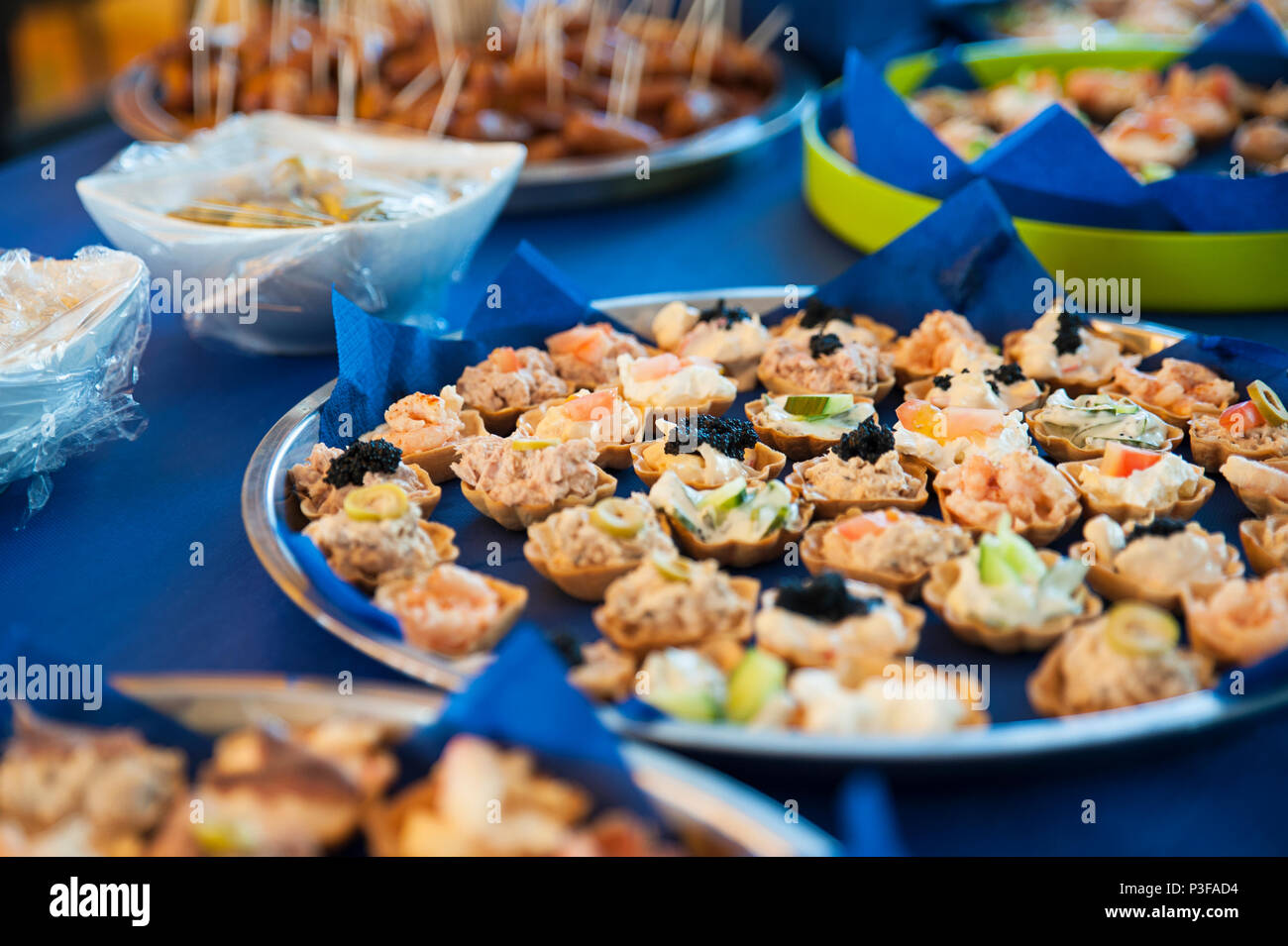 Bite sized snacks on large silver trays, appetizers or hors d'oeuvre at ...