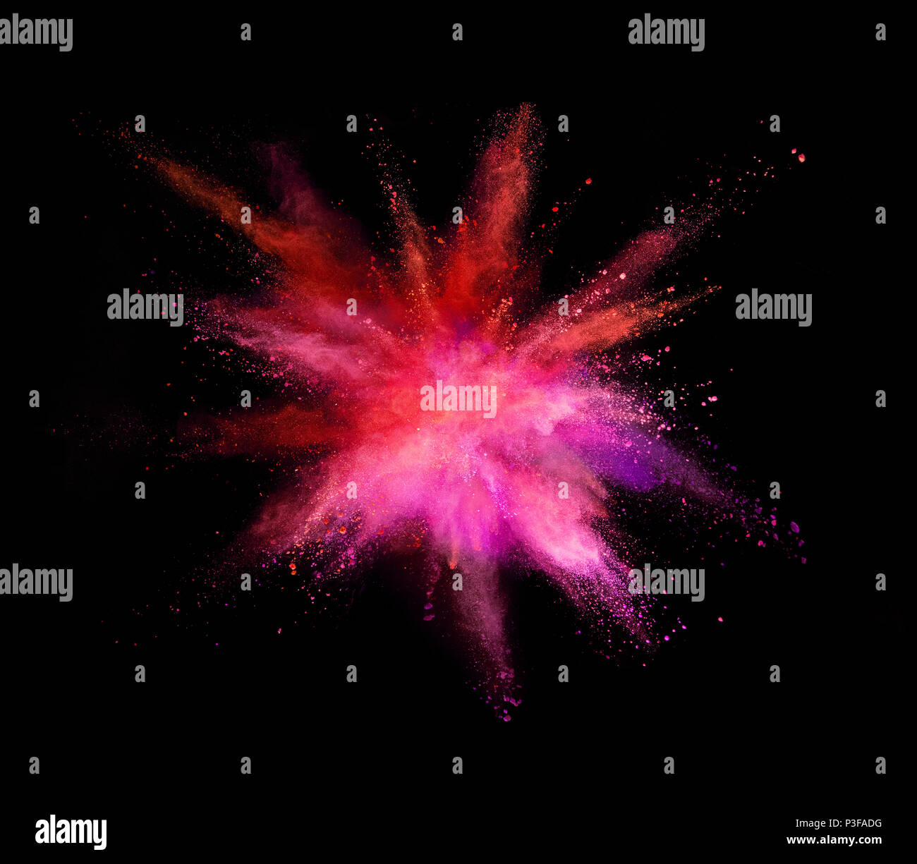 Explosion of coloured powder isolated on black background. Abstract ...